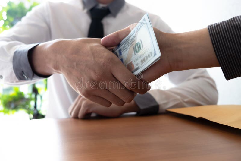 Two Businessman Making Handshake and Receiving a Bribe in the Office ...