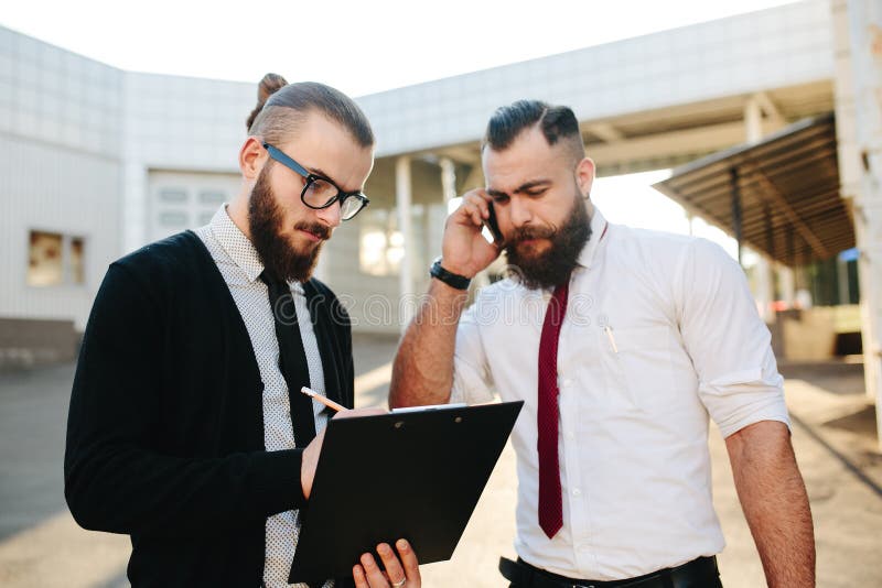 Two businessman at work stock photo. Image of discussing - 69305516