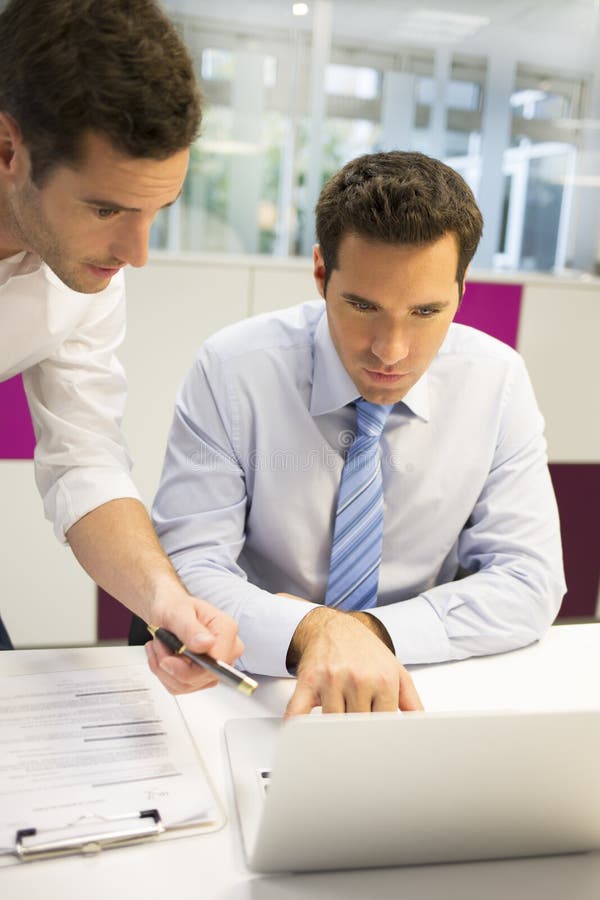 Two Businessman Work in Office on Laptop Stock Photo - Image of ...