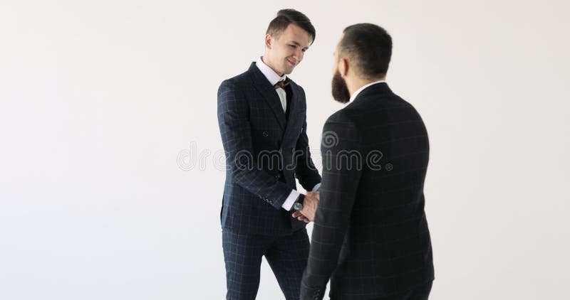 Two Businessmen Approach Each Other and Shake Hands Stock Footage ...