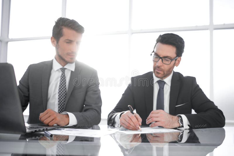 Two Businessmen Discuss Financial Documents Stock Image - Image of ...