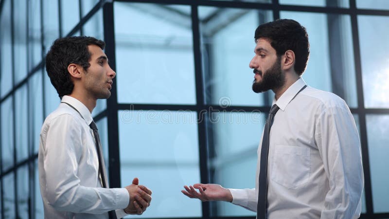 Two Businessmen Discussing in a Meeting in a Modern Office Stock Image ...