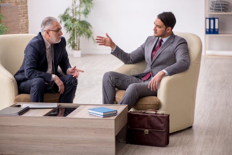 Two Businessmen Discussing Project at Workplace Stock Image - Image of ...