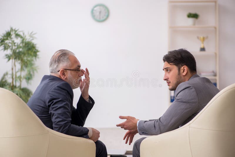 Two Businessmen Discussing Project at Workplace Stock Photo - Image of ...