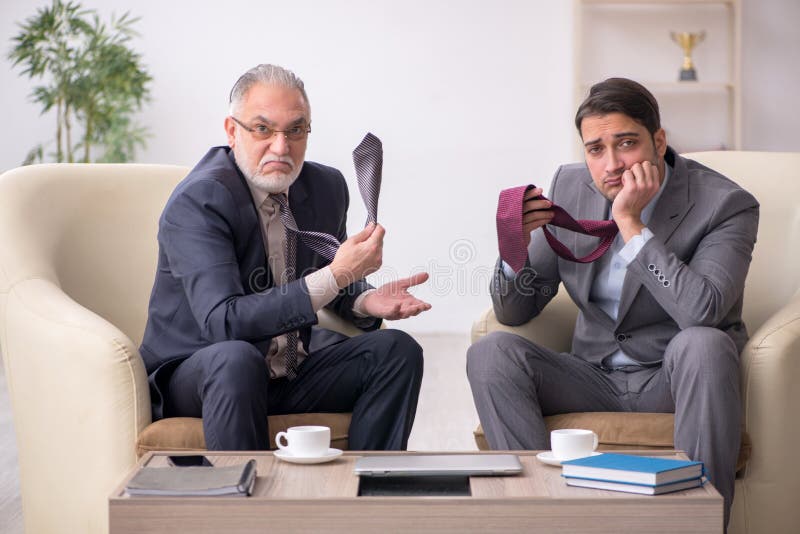 Two Businessmen Discussing Project at Workplace Stock Photo - Image of ...