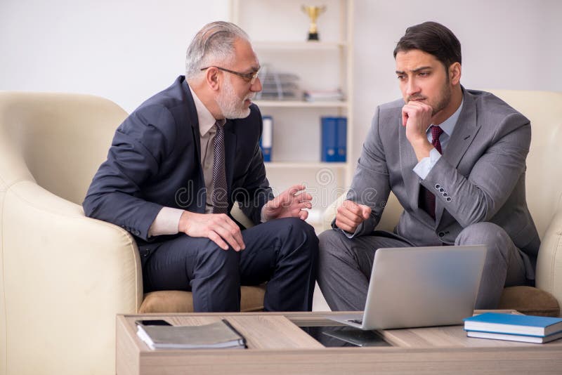 Two Businessmen Discussing Project at Workplace Stock Photo - Image of ...
