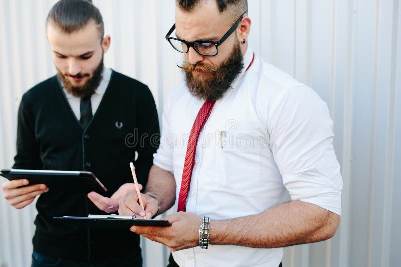 Two Businessmen Discussing Something Stock Photo - Image of fashionable ...