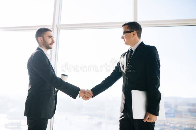 Two Businessmen Handshake in Office Stock Image - Image of digital ...