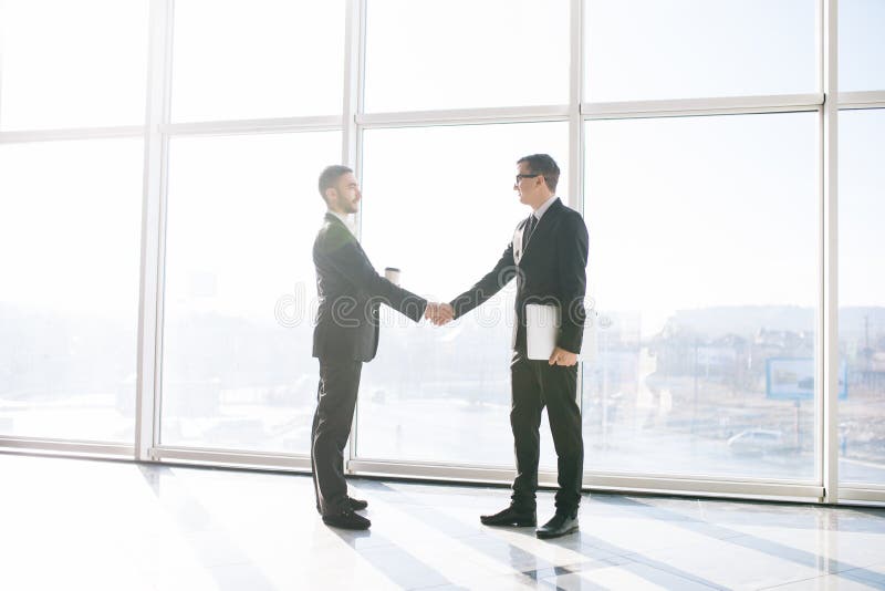 Two Businessmen Handshake in Office Stock Image - Image of sharing ...