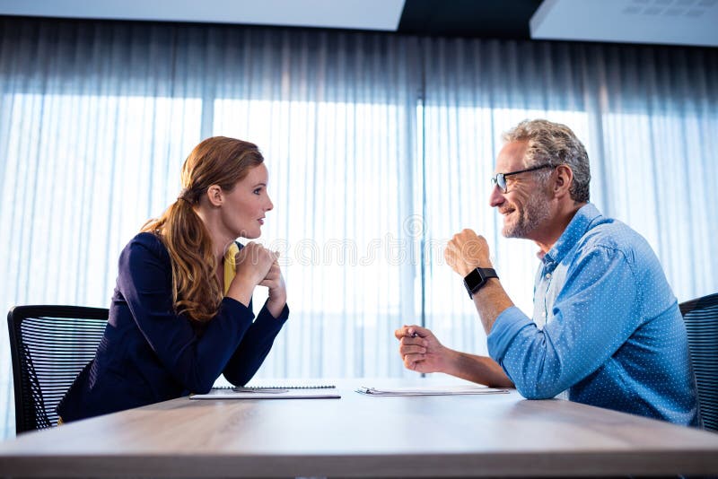 Two Businessmen Interacting Stock Image - Image of corporate, female ...