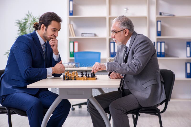 Two Businessmen Playing Chess in the Office Stock Image - Image of ...
