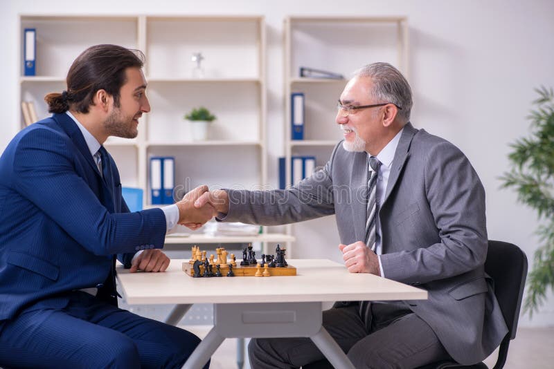 Two Businessmen Playing Chess in the Office Stock Image - Image of game ...