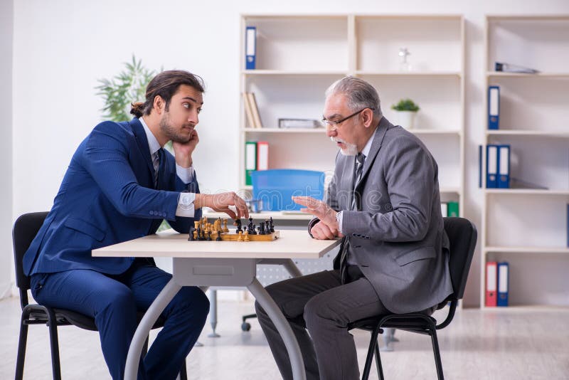 Two Businessmen Playing Chess in the Office Stock Image - Image of game ...
