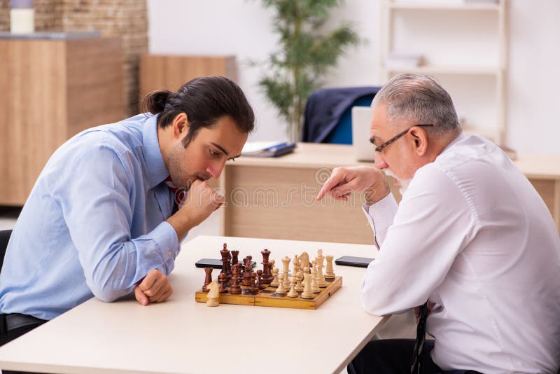 Two Businessmen Playing Chess in the Office Stock Image - Image of ...