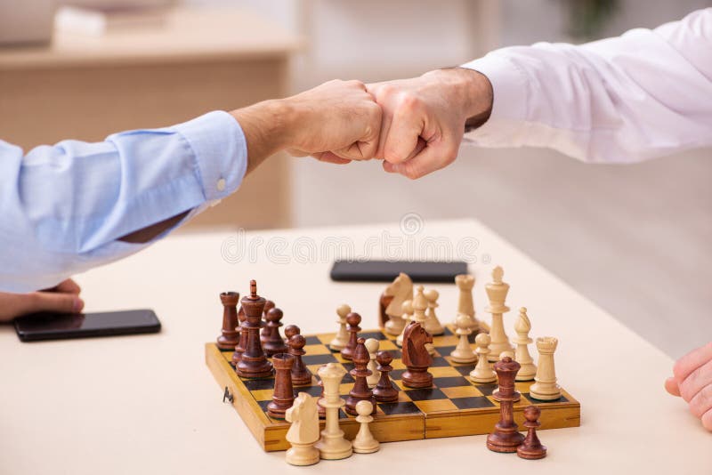 Two Businessmen Playing Chess in the Office Stock Image - Image of ...