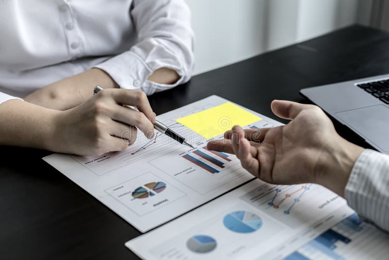 Two Businessmen Pointed To the Material for the Meeting, Working ...