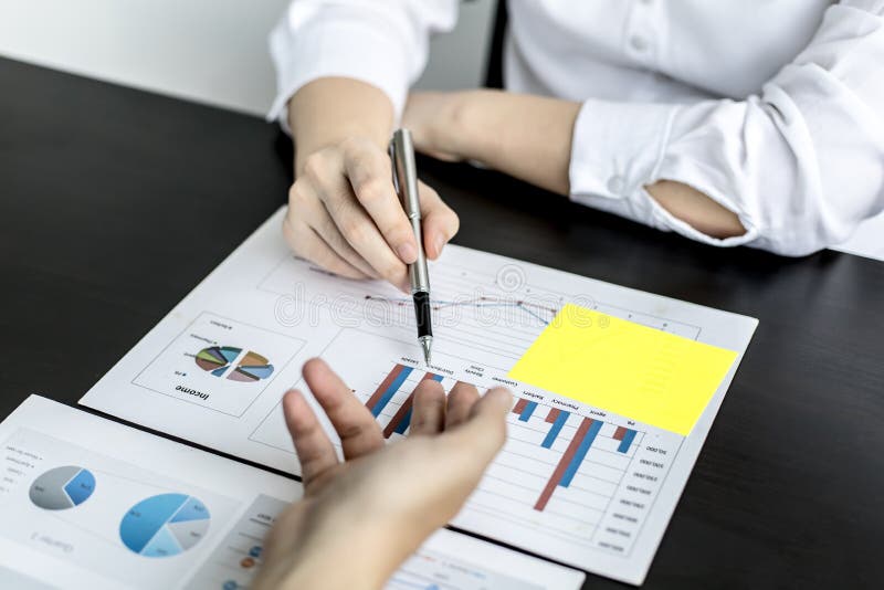 Two Businessmen Pointed To the Material for the Meeting, Working ...