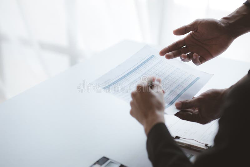 Two Businessmen Pointed To the Material for the Meeting, Working ...