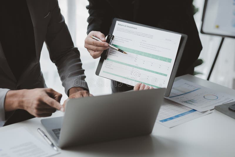 Two Businessmen Pointed To the Material for the Meeting, Working ...