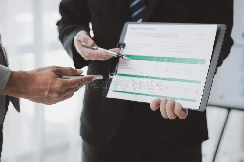 Two Businessmen Pointed To the Material for the Meeting, Working ...