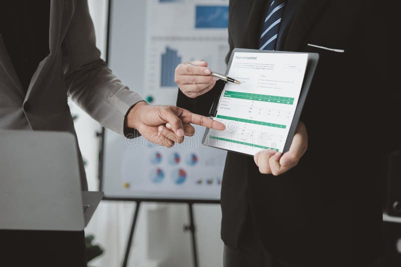 Two Businessmen Pointed To the Material for the Meeting, Working ...