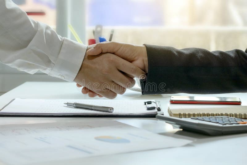 Two Businessmen Shake Hands after the End of a Team Stock Photo - Image ...
