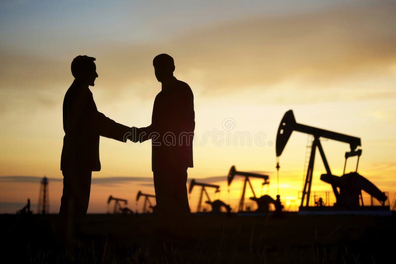 Two Businessmen Shaking Hands in Front of an Oil Pump. Stock Image ...