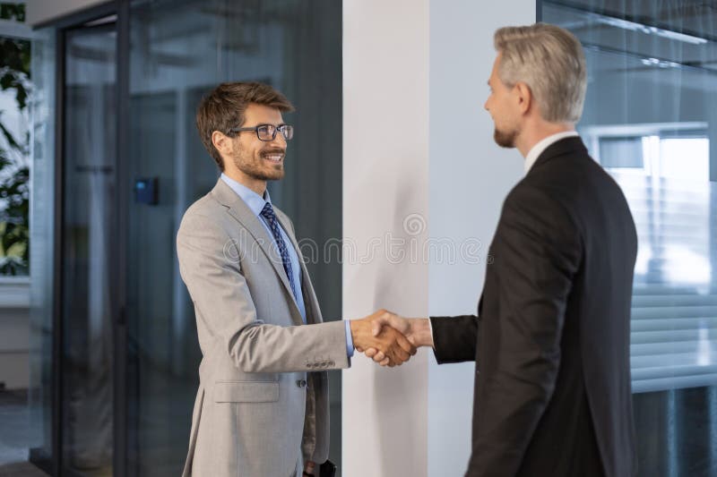 Two Businessmen Shaking Hands after Meeting. Stock Photo - Image of ...