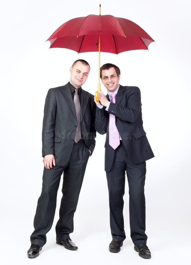 Two Businessmen Standing Under An Umbrella Stock Image - Image: 19914129 Two Businessmen Standing Under An Umbrella Stock Image - Image: 19914129