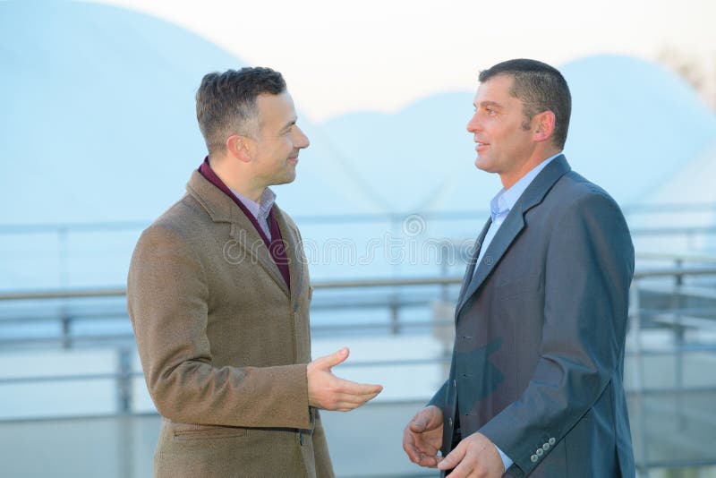 Two Businessmen Talking Outdoors Stock Image - Image of businessperson ...
