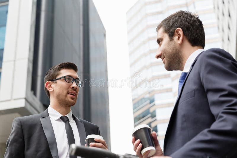 Two Businessmen Talking Outdoors Stock Image - Image of colleagues ...