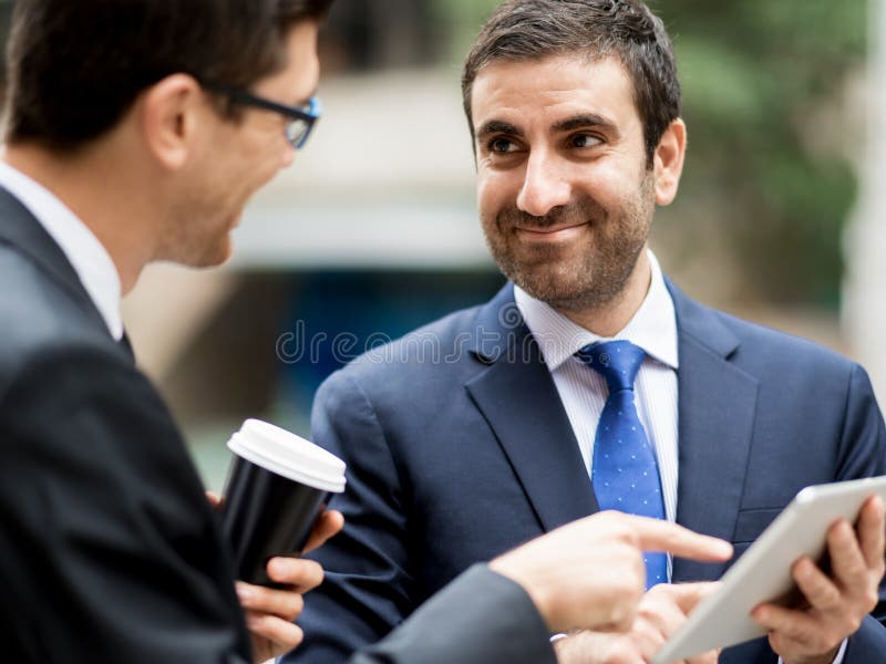 Two Businessmen Talking Outdoors Stock Image - Image of colleagues ...