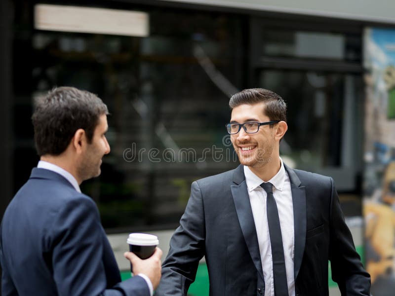 Two Businessmen Talking Outdoors Stock Image - Image of happy, chatting ...