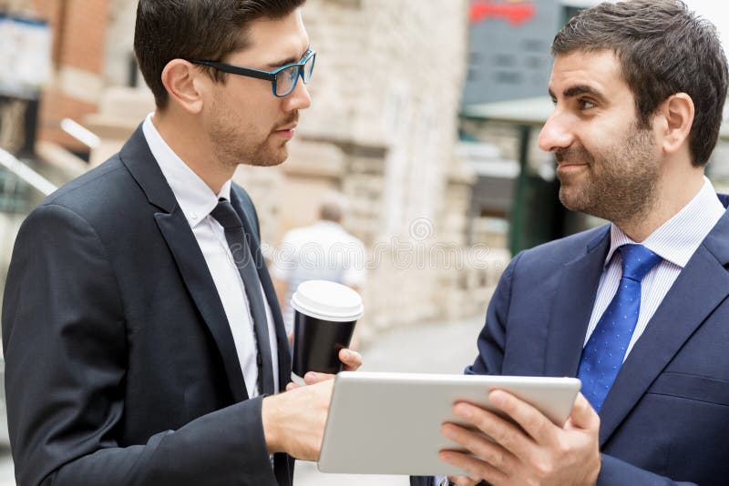 Two Businessmen Talking Outdoors Stock Photo - Image of business ...