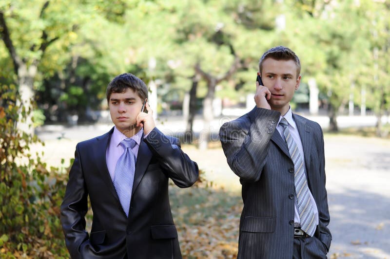 Two Businessmen Talking On The Phone Stock Photo - Image of caucasian ...