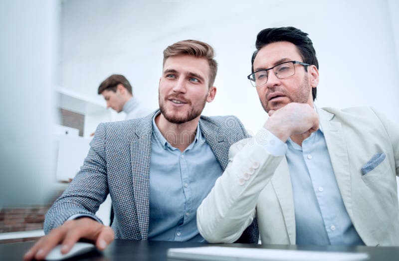 Two Businessmen Use a Computer To Get New Information Stock Image ...