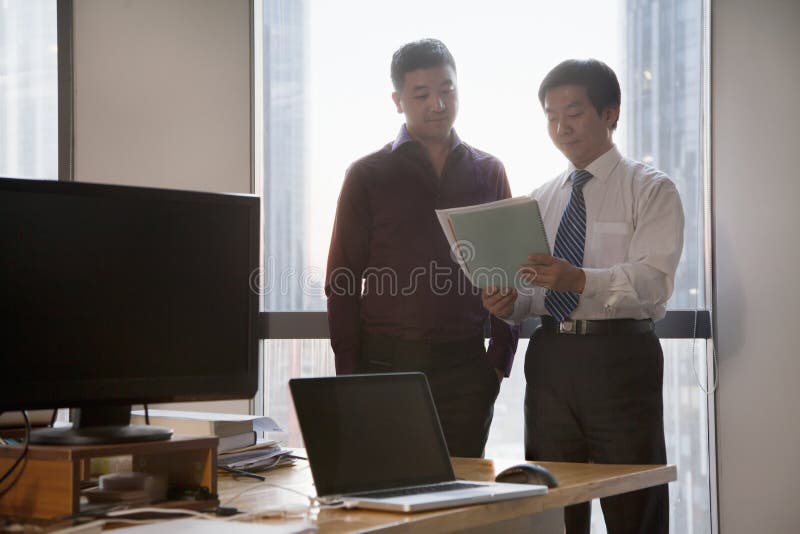 Two Businessmen Working Together in the Office Stock Image - Image of ...