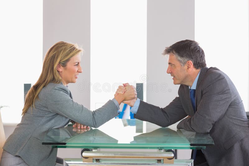 Two Businesspeople Having a Showdown Sitting Around a Table Stock Image ...