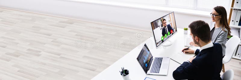 Two Businesspeople Video Conferencing on Computer Stock Image - Image ...