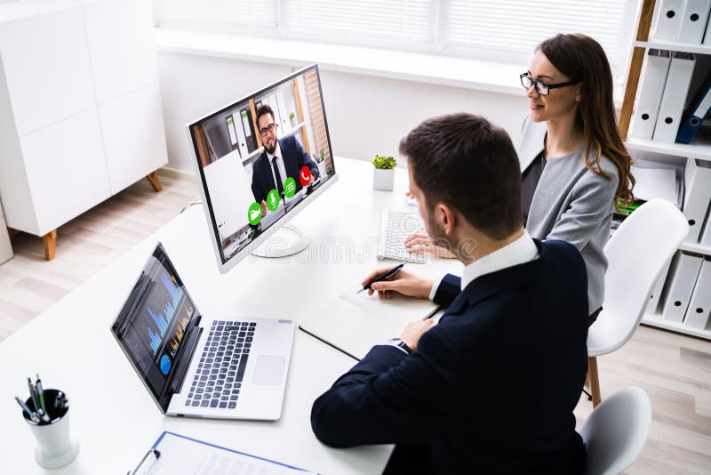 Two Businesspeople Video Conferencing on Computer Stock Image - Image ...