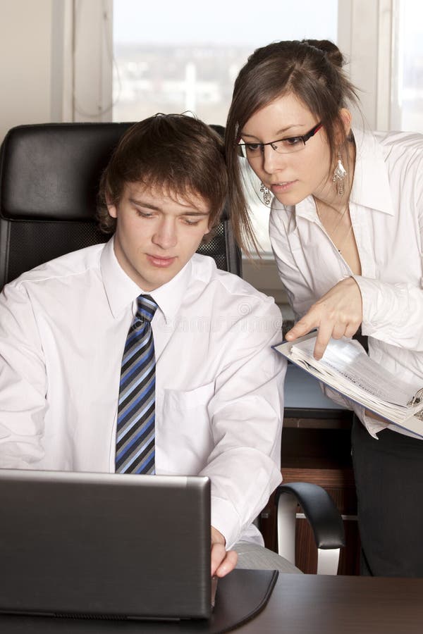 Two businesspeople working stock photo. Image of team - 22685928