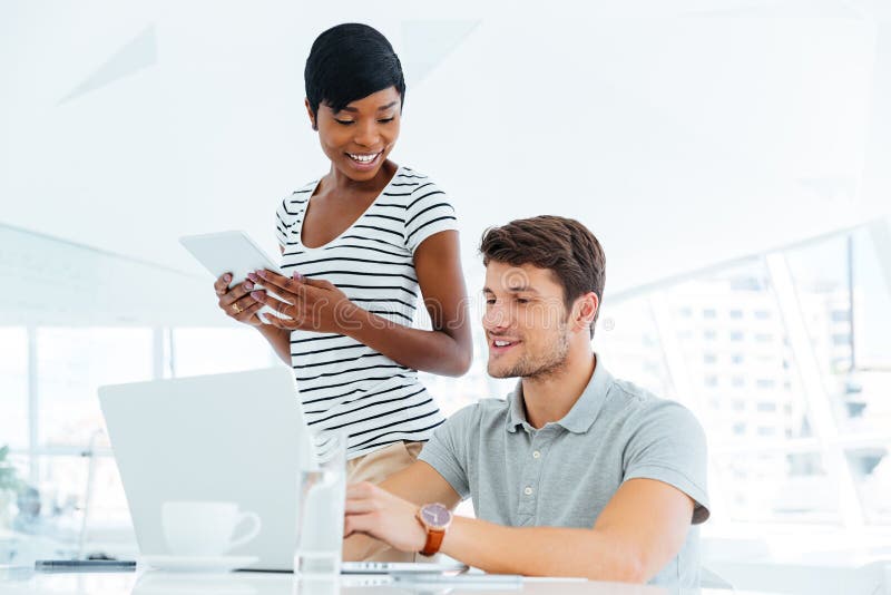 Two Businesspeople Working in Office and Discussing New Ideas Stock ...