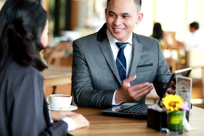 Two Businesss People Talking about Planning Work at Cafe Stock Image ...