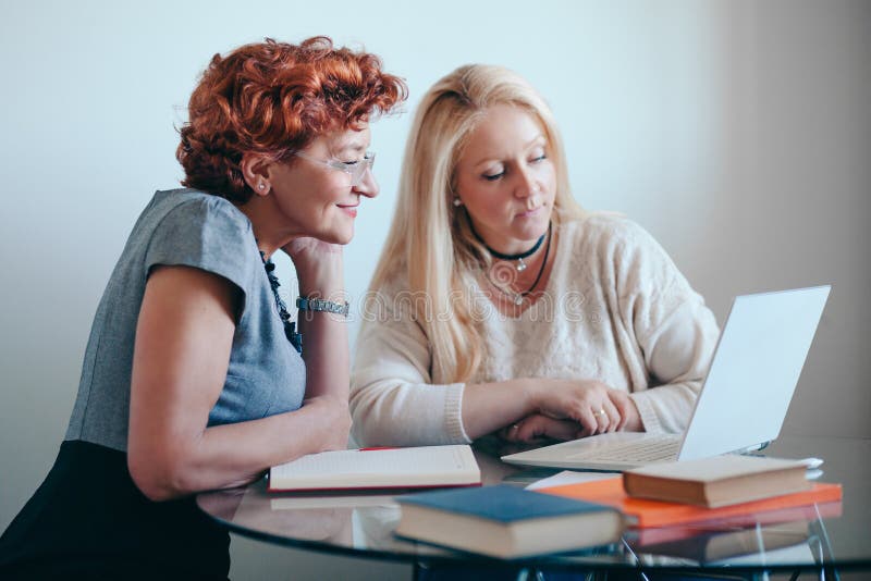 Two Businesswoman Exchanging Ideas Stock Photo - Image of ideas ...