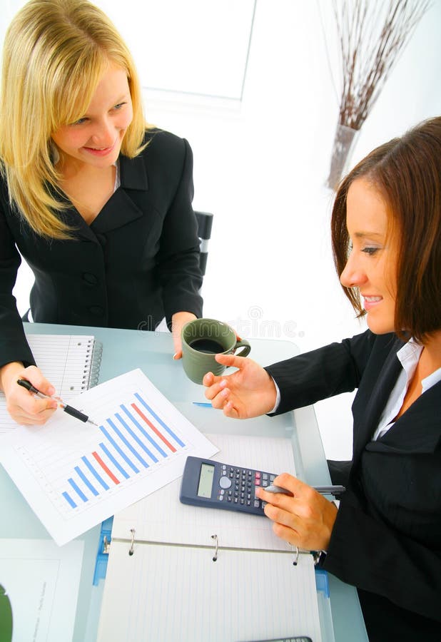 Two Businesswoman Working on Numbers Stock Photo - Image of beauty ...