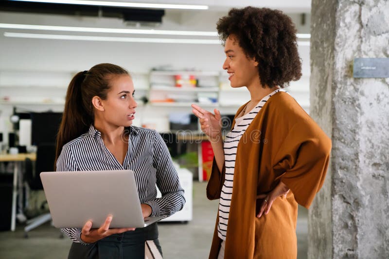 Two Businesswoman Working Together Using Digital Tablet Pc and Talking ...