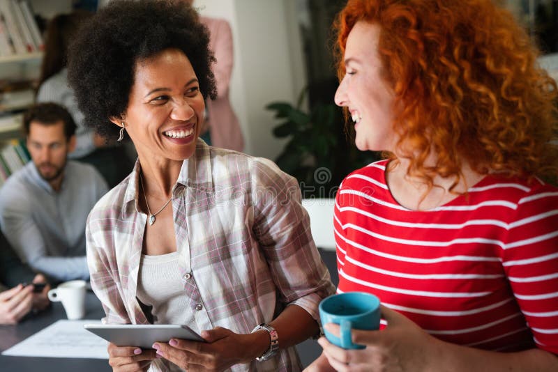 Two Businesswoman Working Together Using Digital Tablet Pc and Talking ...