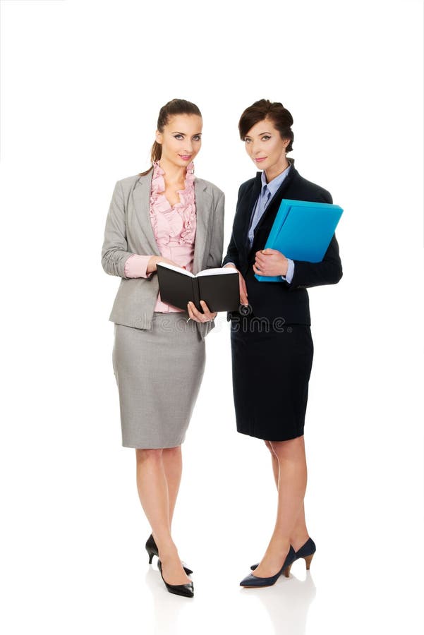 Two Businesswomans Discussing with Eachother. Stock Image - Image of ...
