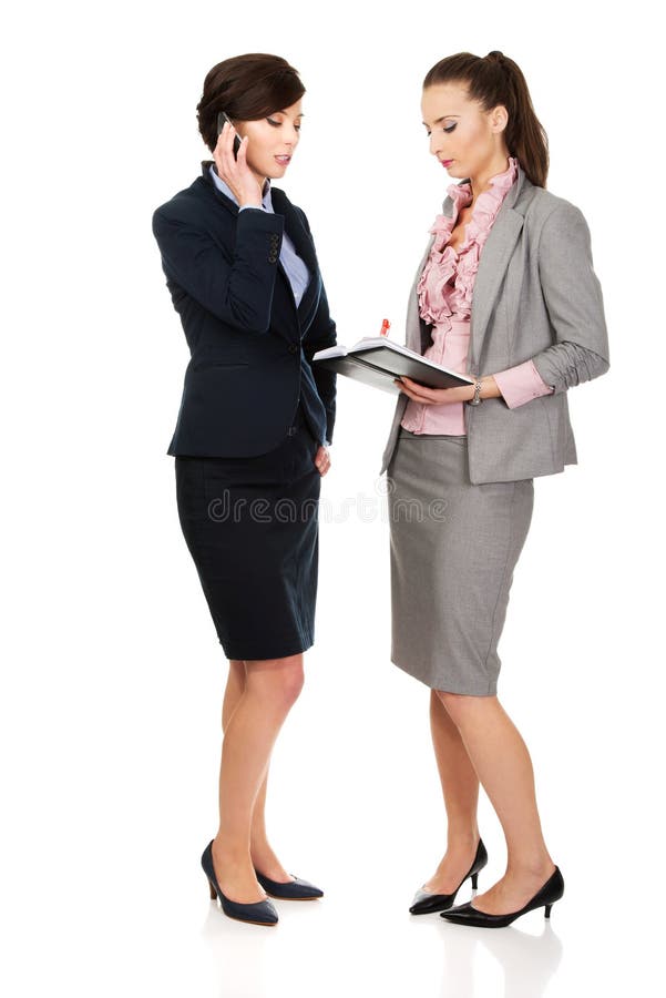 Two Businesswomans Discussing with Eachother. Stock Image - Image of ...