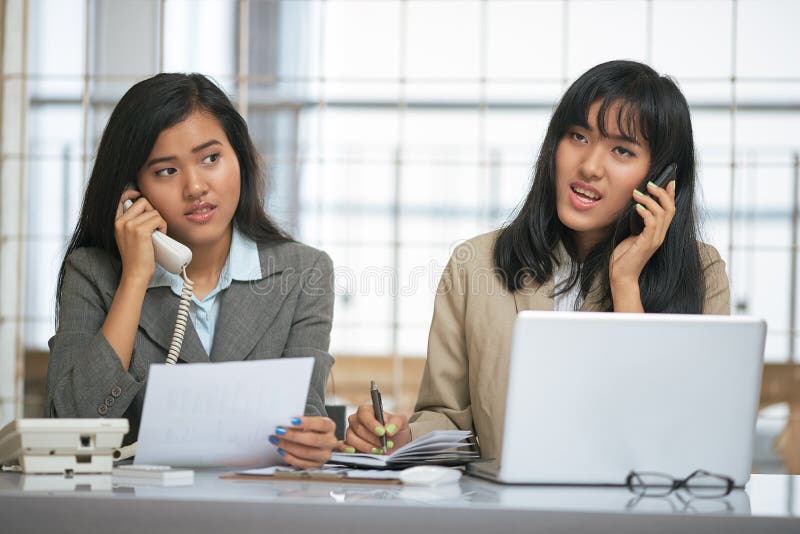 Two Businesswomen Communicating on the Phone Stock Photo - Image of ...
